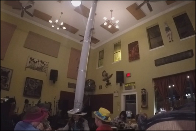 Artist creates “world’s tallest” hat measuring 18-foot, 9-inch